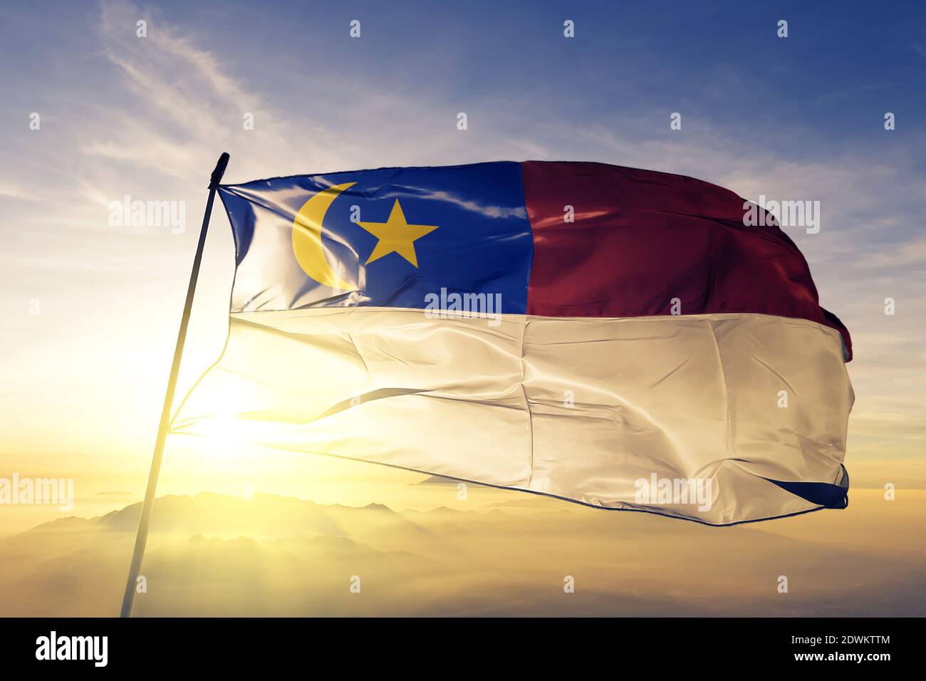 Malacca state of Malaysia flag waving on the top sunrise mist fog Stock ...