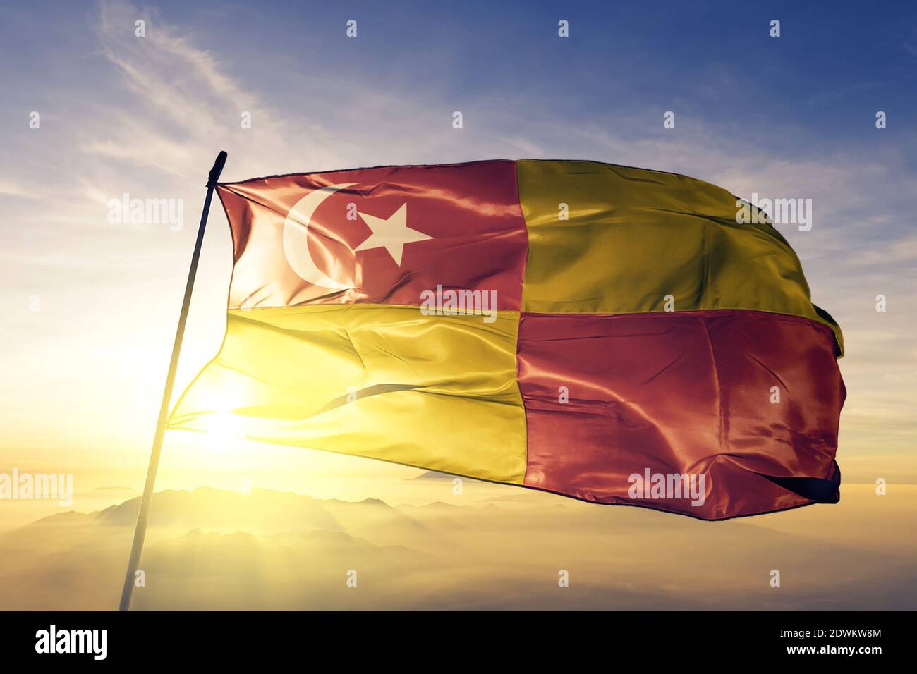 Selangor state of Malaysia flag waving on the top sunrise mist fog ...