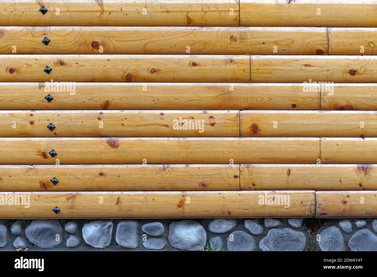 Wood planks boards wall at stone base Stock Photo - Alamy