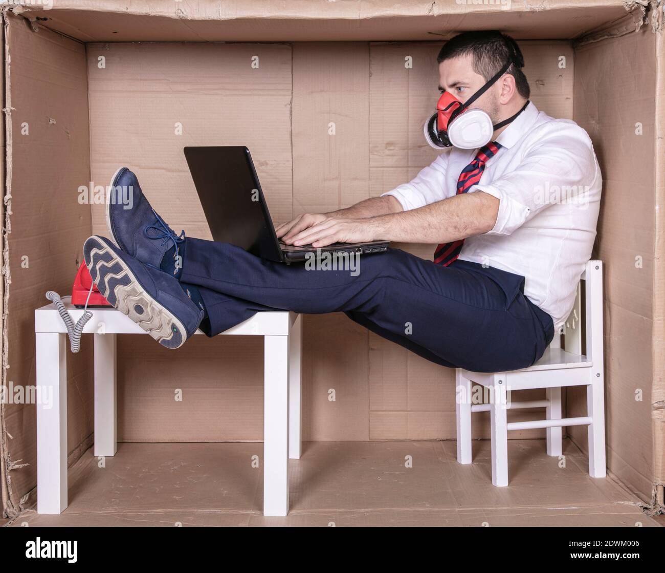 strange position when working in the office Stock Photo - Alamy