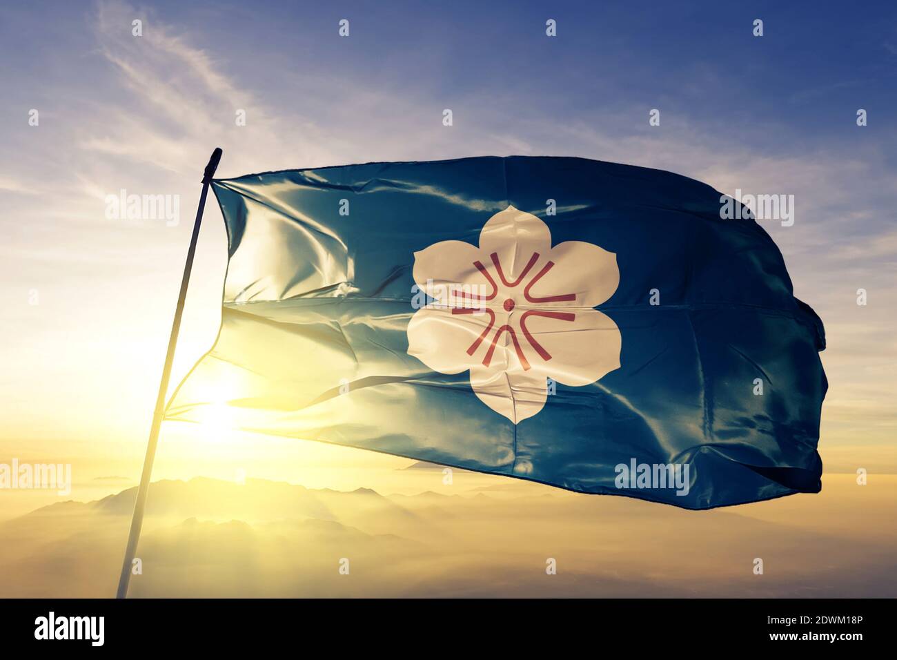 Saga prefecture of Japan flag waving on the top sunrise mist fog Stock ...