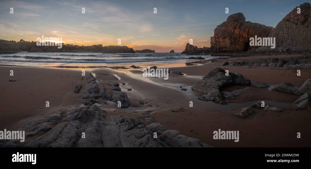 Beautiful panoramic view of the Portio Beach at sunset in Liencres ...