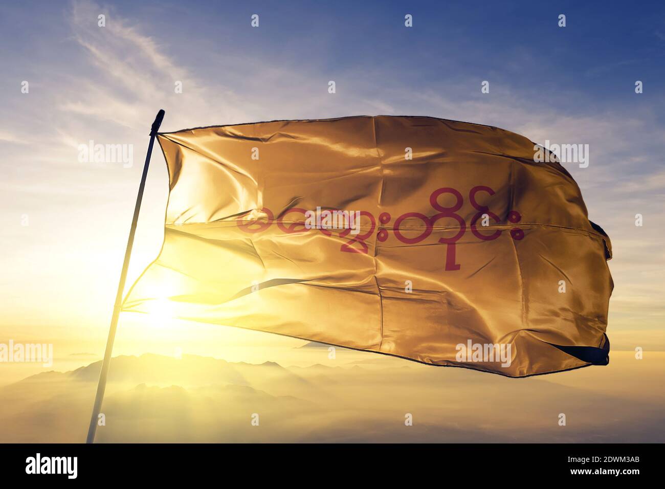 Magway region of Myanmar flag waving on the top sunrise mist fog Stock ...