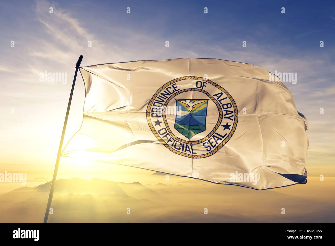 Albay province of Philippines flag waving on the top sunrise mist fog ...