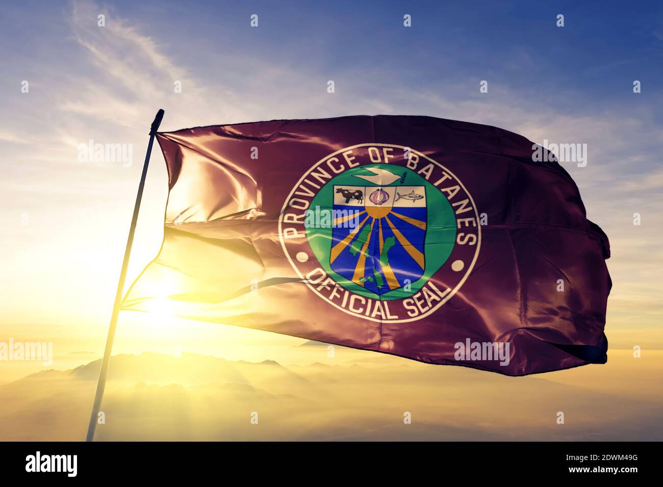 Batanes province of Philippines flag waving on the top sunrise mist fog ...