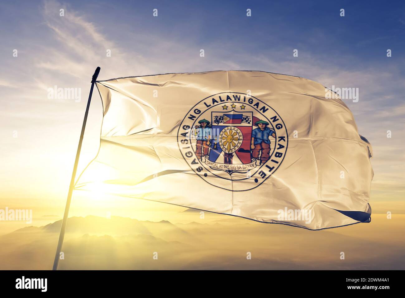 Cavite province of Philippines flag waving on the top sunrise mist fog ...