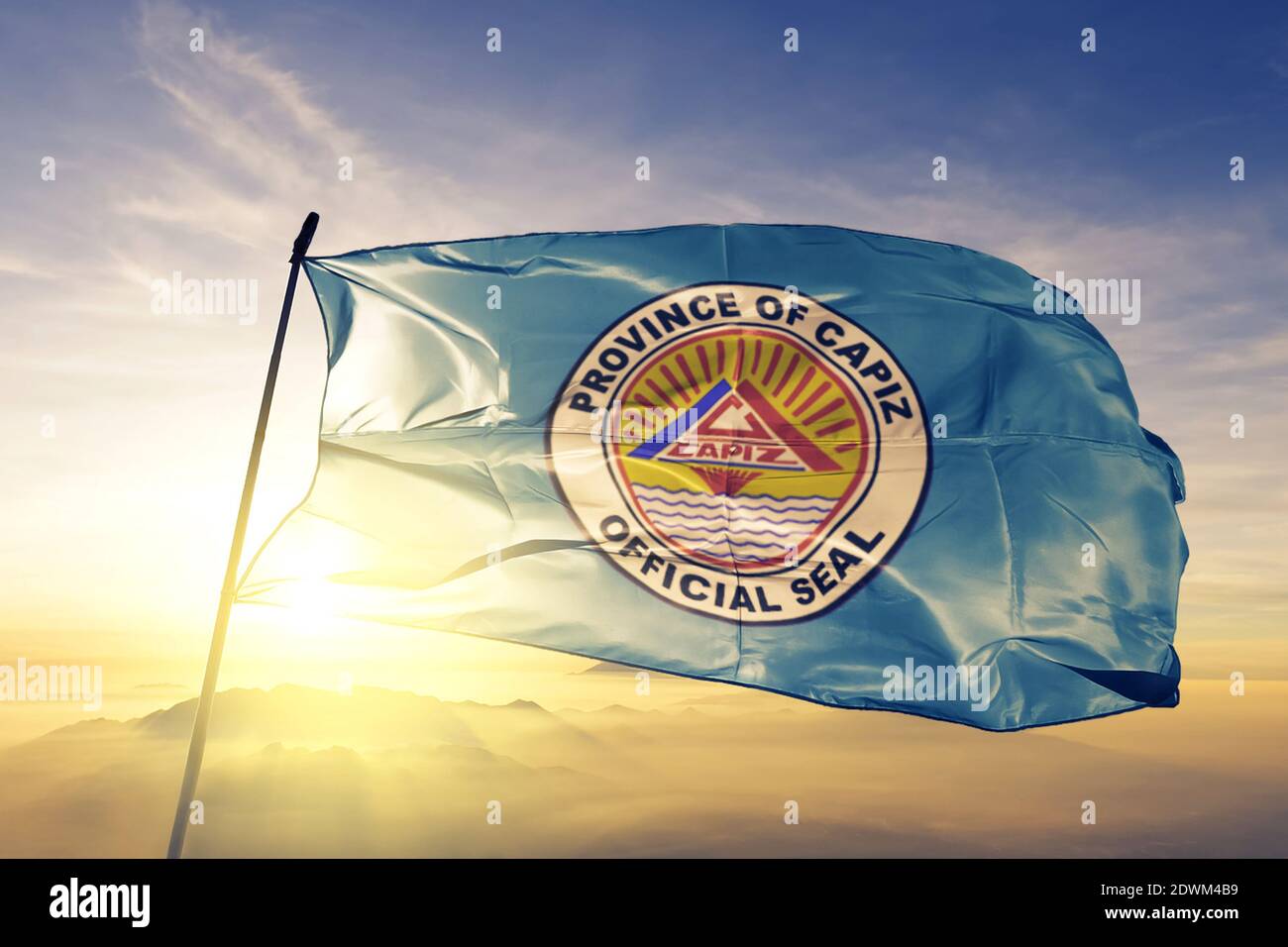 Capiz province of Philippines flag waving on the top sunrise mist fog ...