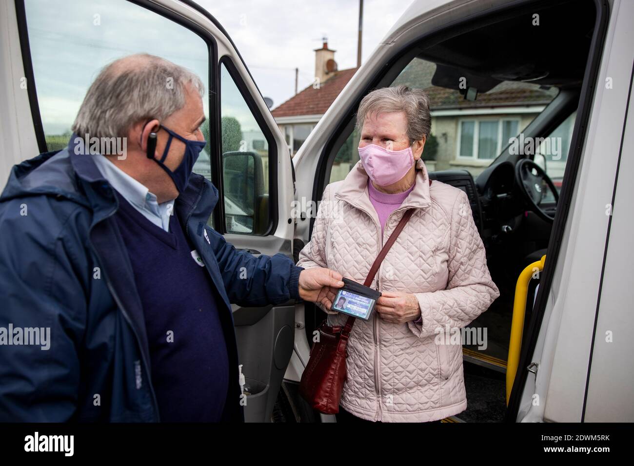 Easilink driver John Devine checking the bus pass of Mary Richmond as ...