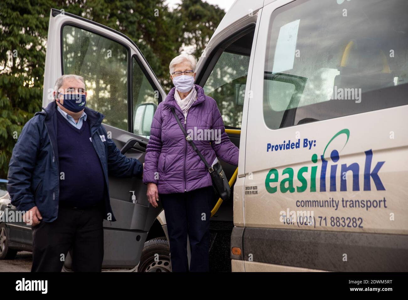 Easilink driver John Devine with client Mary Alice Dunn as she boards ...