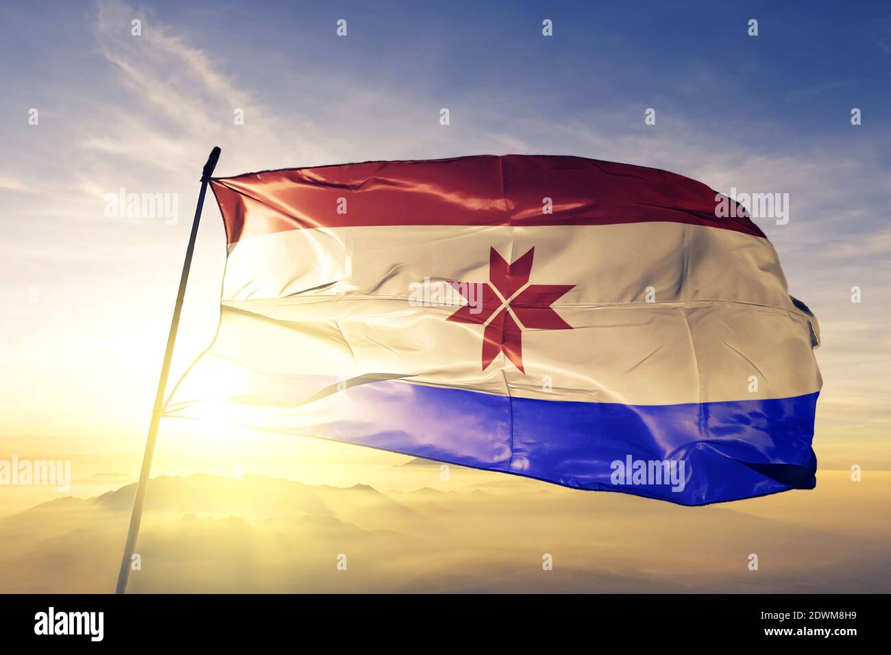 Mordovia Republic of Russia flag waving on the top sunrise mist fog ...