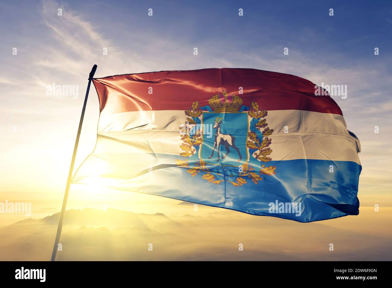 Samara oblast of Russia flag waving on the top sunrise mist fog Stock ...
