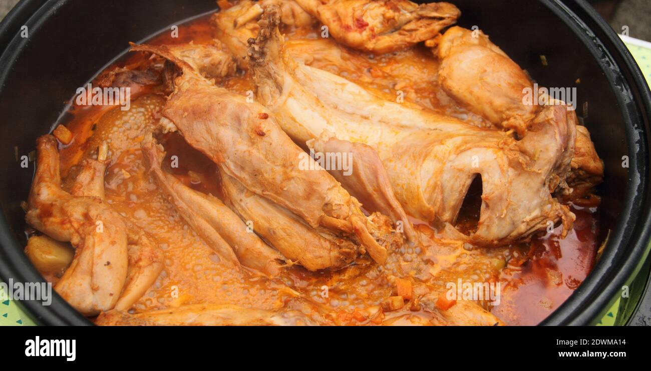 Rabbit fried in a pan with carrot and onion Stock Photo - Alamy