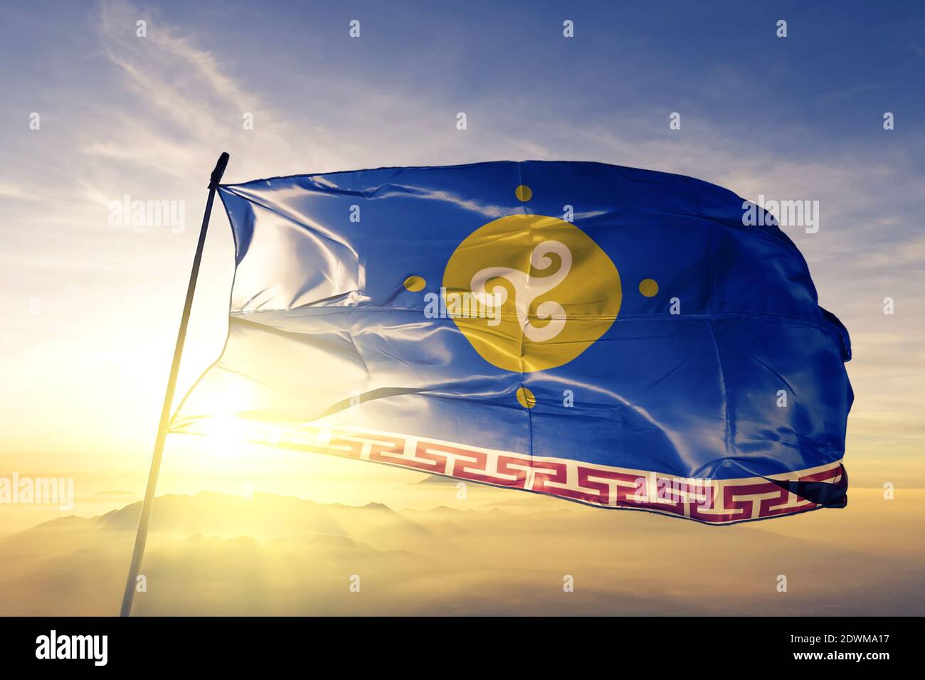 Ust-Orda Buryat Okrug of Russia flag waving on the top sunrise mist fog ...