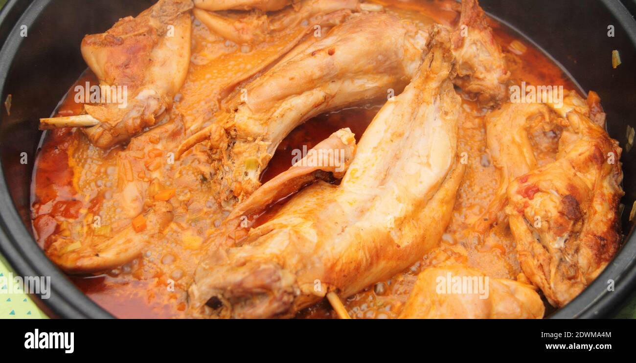 Rabbit fried in a pan with carrot and onion Stock Photo - Alamy