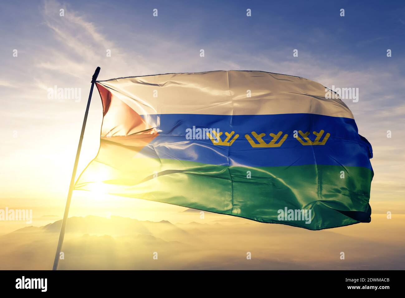 Tyumen oblast of Russia flag waving on the top sunrise mist fog Stock ...