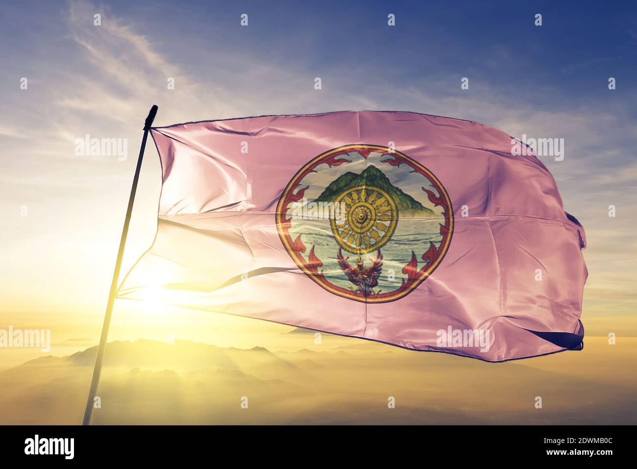 Chai Nat province of Thailand flag waving on the top sunrise mist fog ...