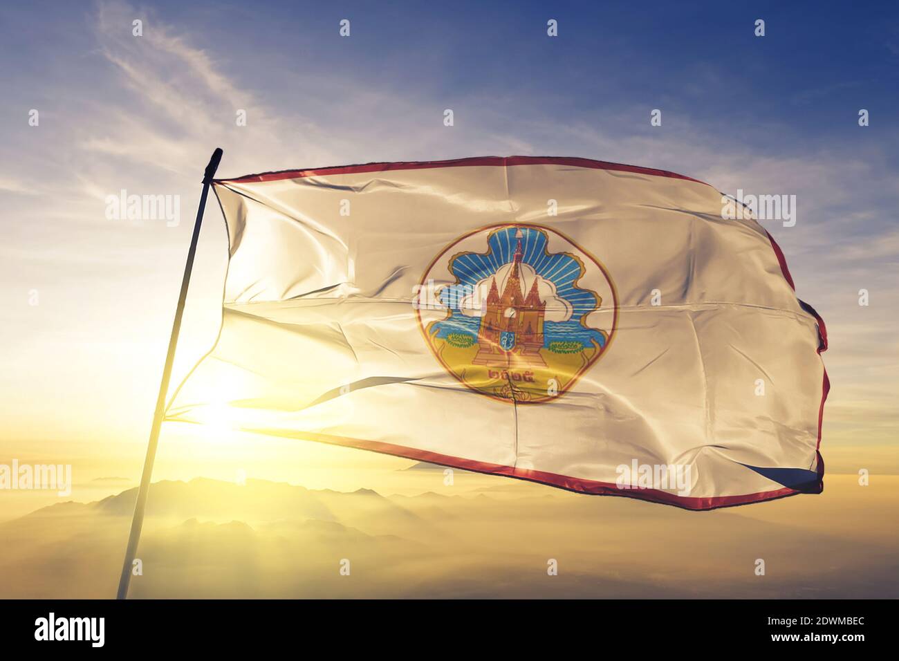 Mukdahan province of Thailand flag waving on the top sunrise mist fog ...