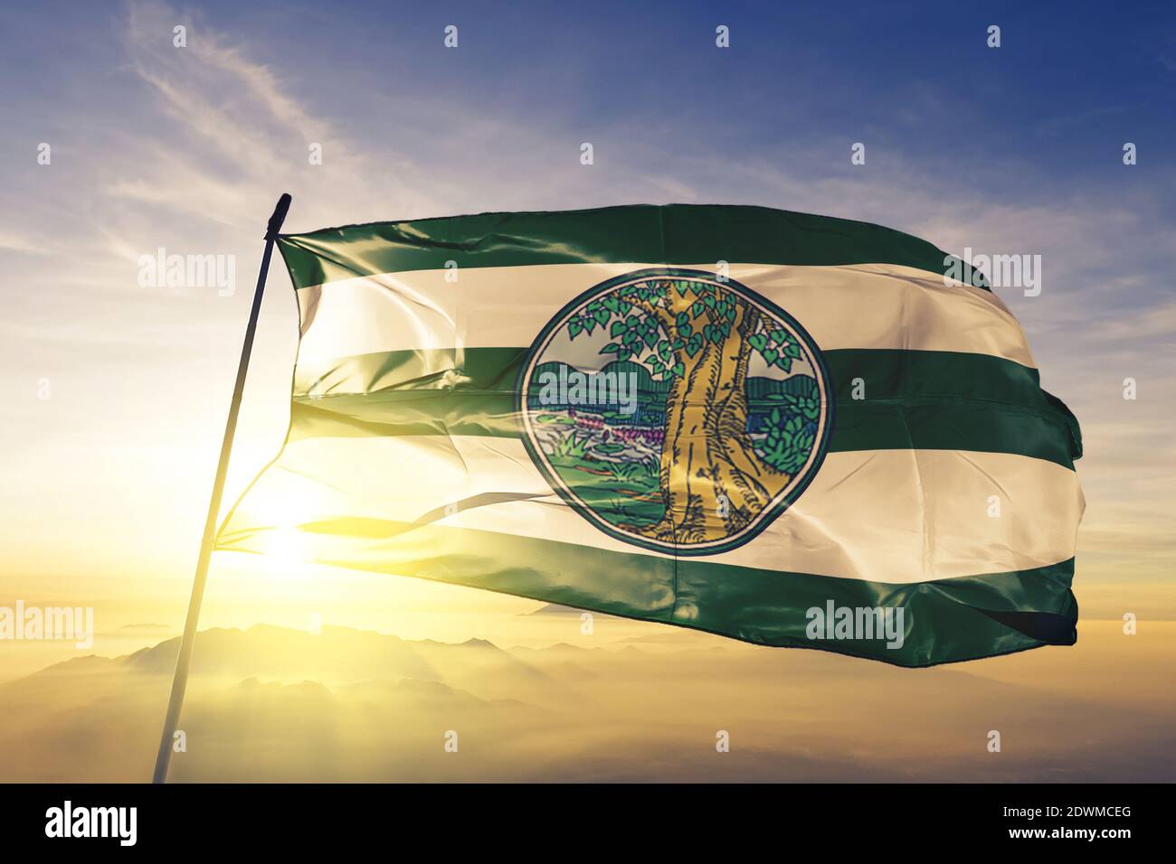 Phichit province of Thailand flag waving on the top sunrise mist fog ...