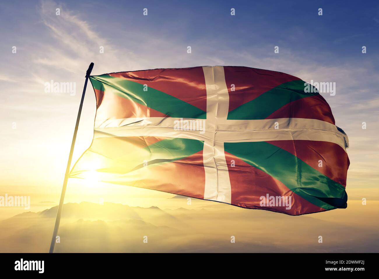 Basque Country of Spain flag waving on the top sunrise mist fog Stock ...