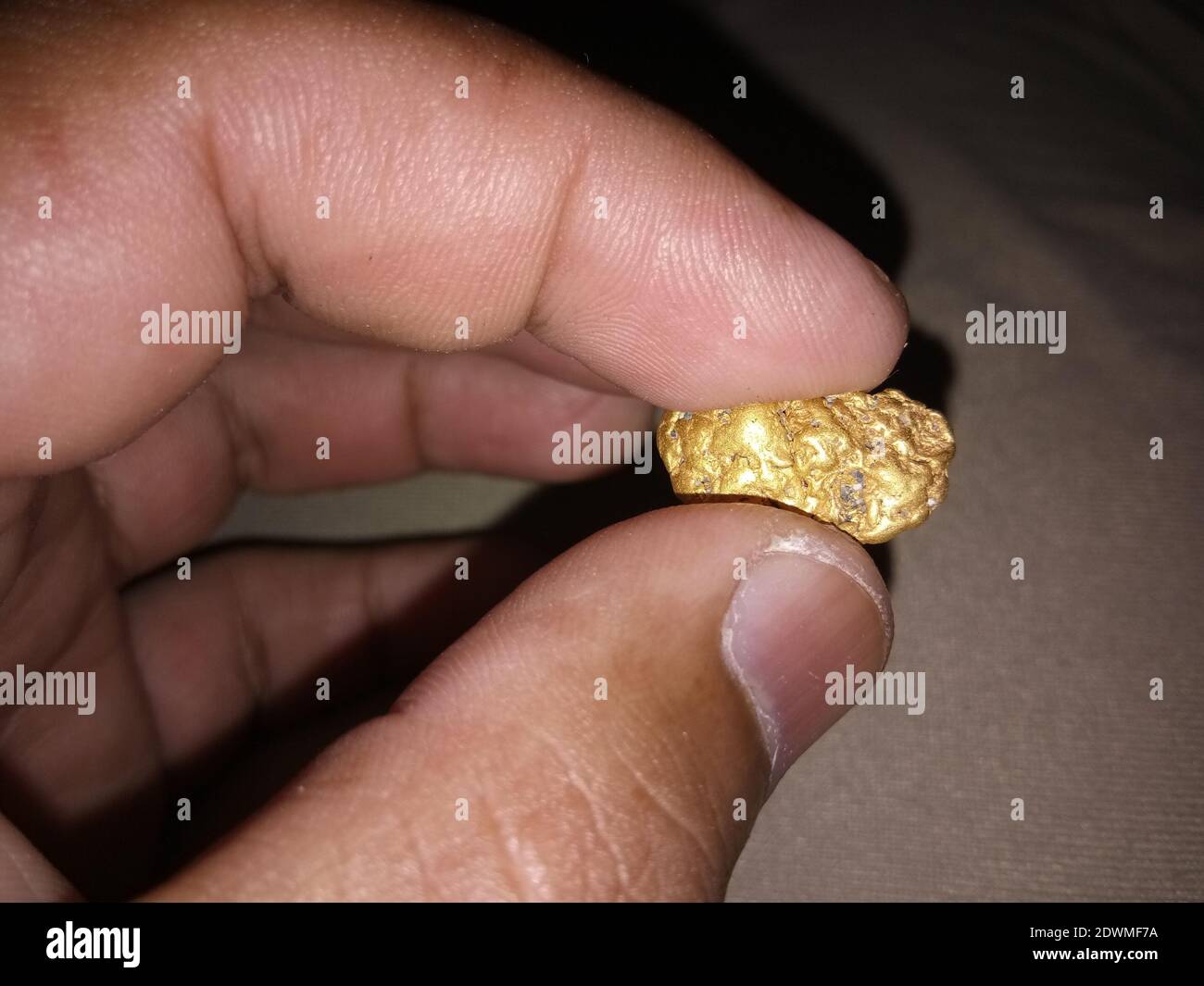 Gold nugget holding hi-res stock photography and images - Alamy