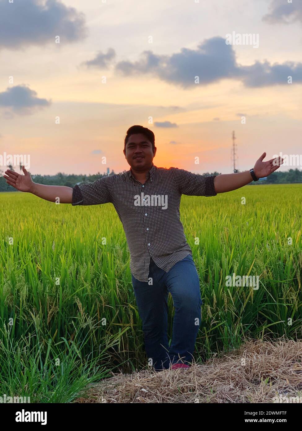 South indian man standing arms hi-res stock photography and images - Alamy