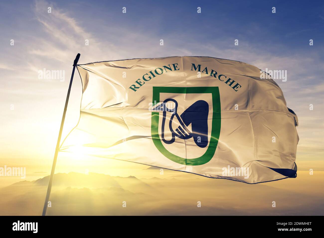 Marche region of Italy flag waving on the top sunrise mist fog Stock ...