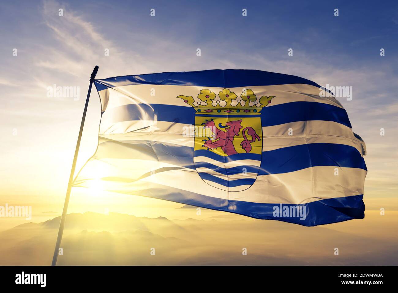 Zeeland province of Netherlands flag waving on the top sunrise mist fog ...