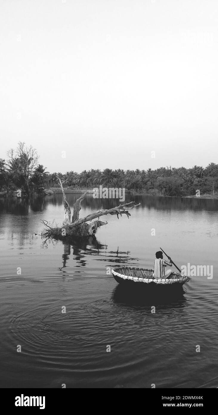 Man and coracle hi-res stock photography and images - Alamy