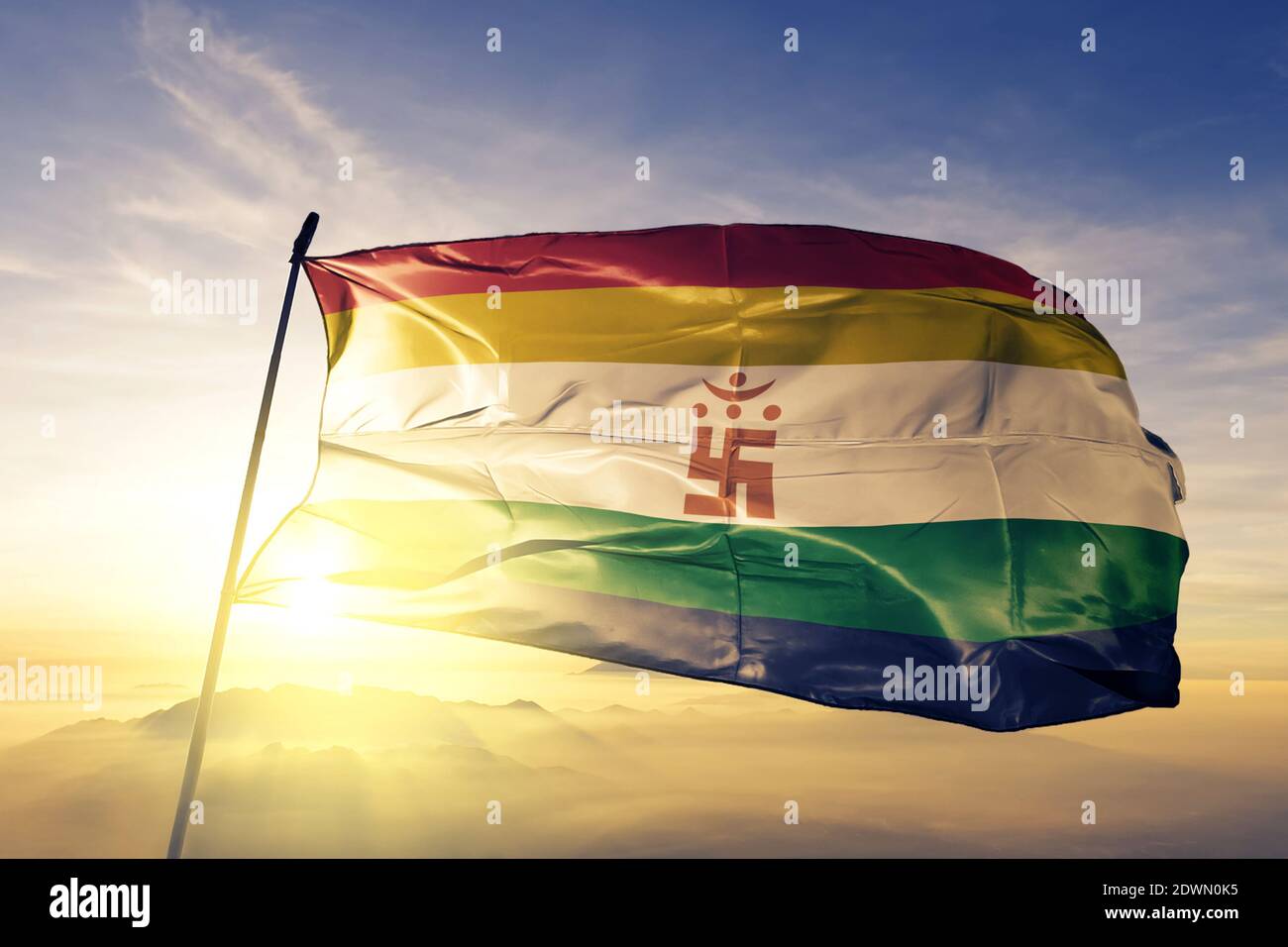 Jainism flag waving on the top sunrise mist fog Stock Photo - Alamy