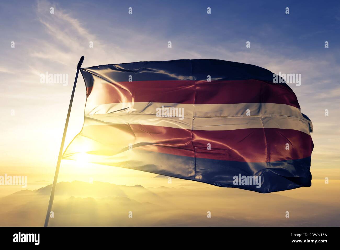 Satanism flag waving on the top sunrise mist fog Stock Photo - Alamy