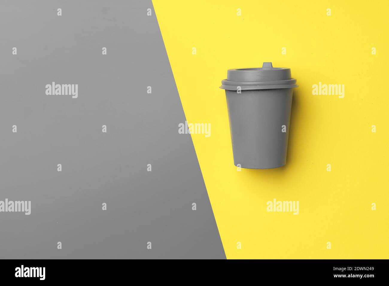 Disposable coffee cup in yellow gray colors Stock Photo - Alamy