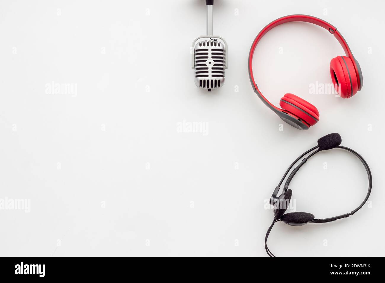 Studio microphone and headphones, top view. Recording podcast and ...