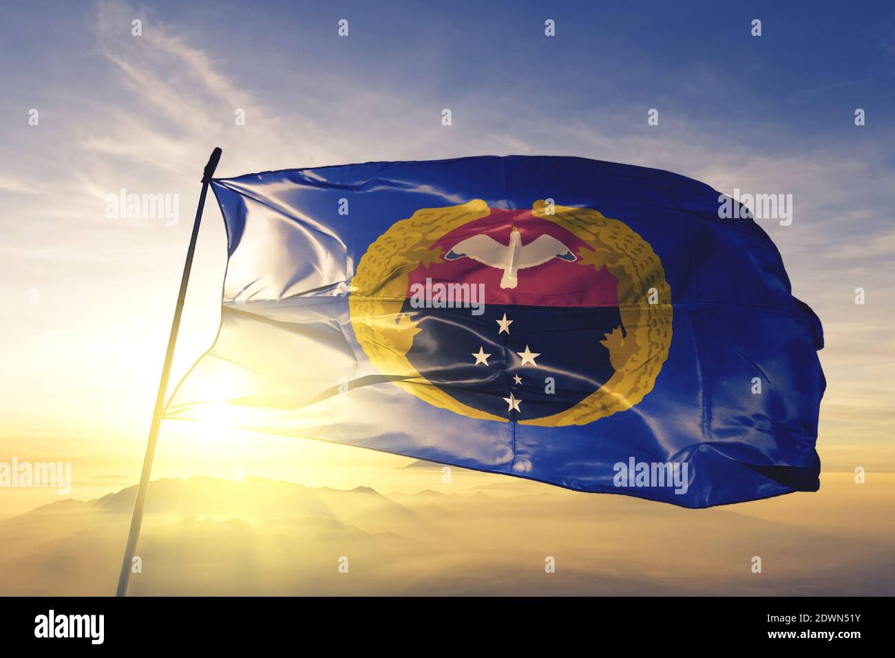 Gulf province of Papua New Guinea flag waving on the top sunrise mist ...