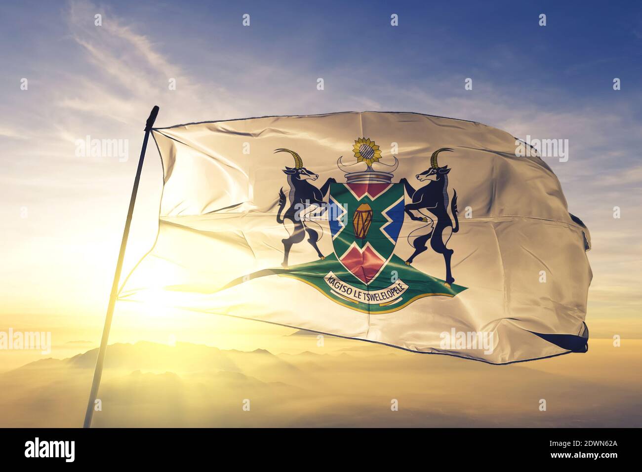 North West province of South Africa flag waving on the top sunrise mist ...