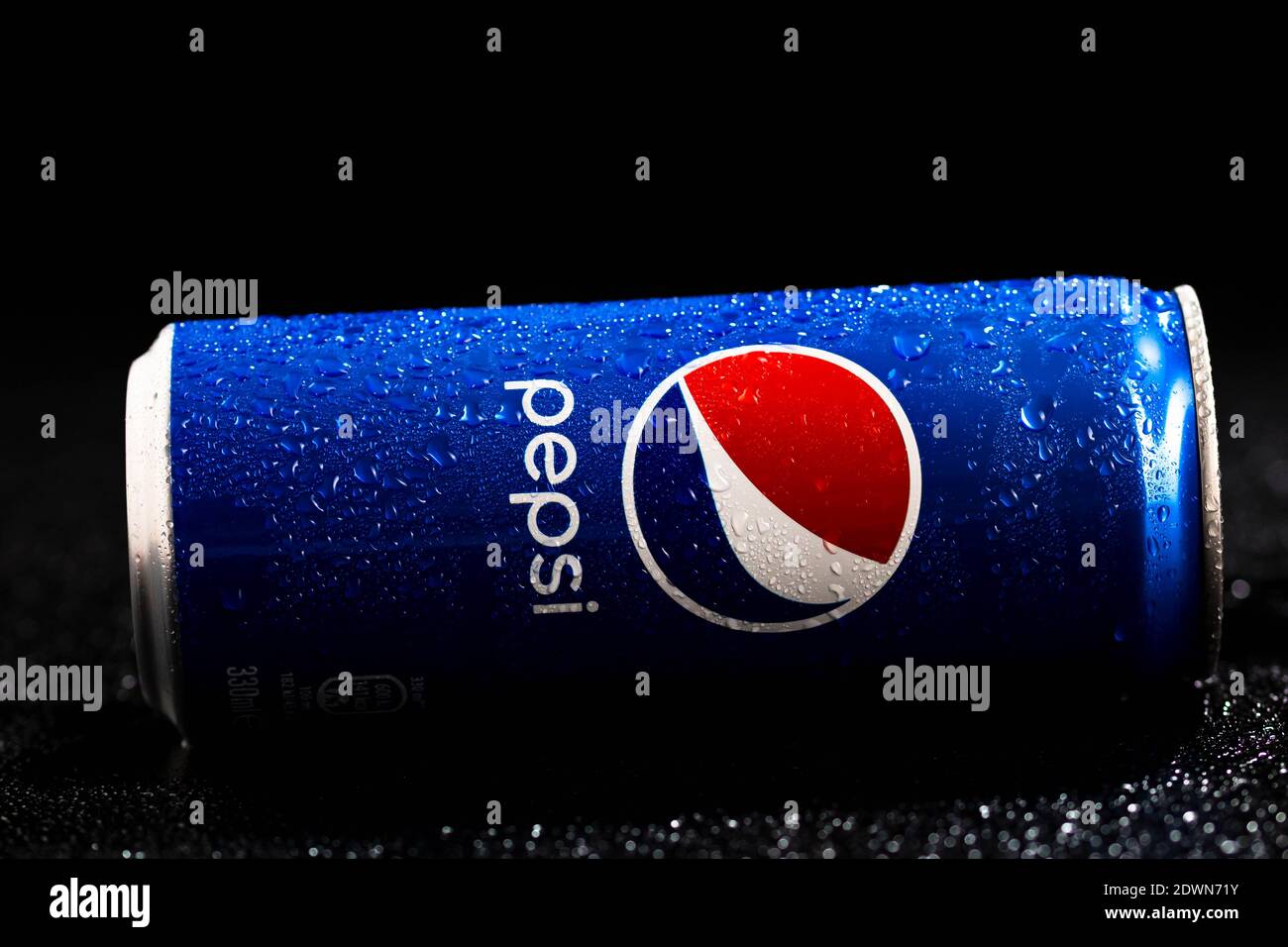 Editorial photo of Pepsi can with water droplets on black background ...