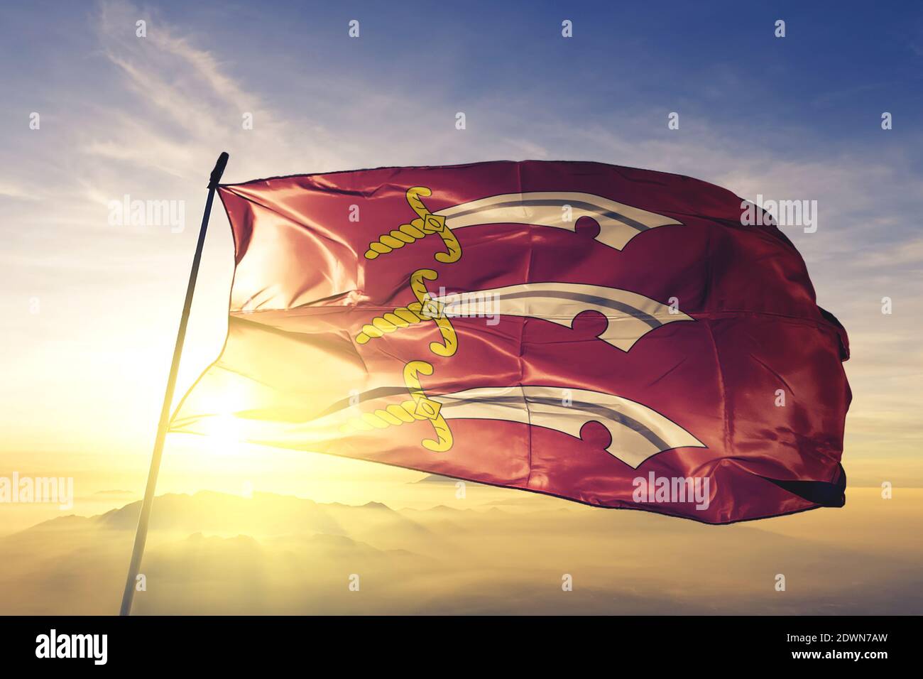 Essex county of England flag waving on the top sunrise mist fog Stock ...