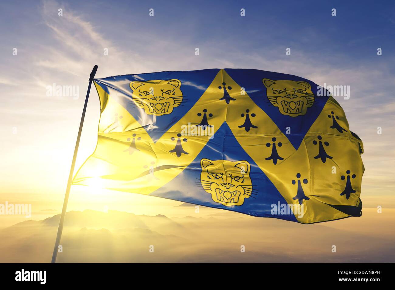 Shropshire county of England flag waving on the top sunrise mist fog ...
