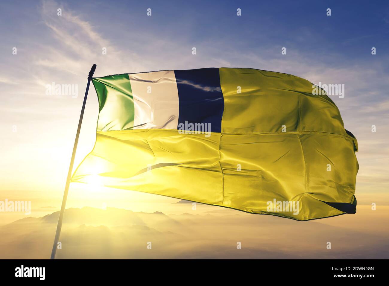 Greater Accra region of Ghana flag waving on the top sunrise mist fog ...