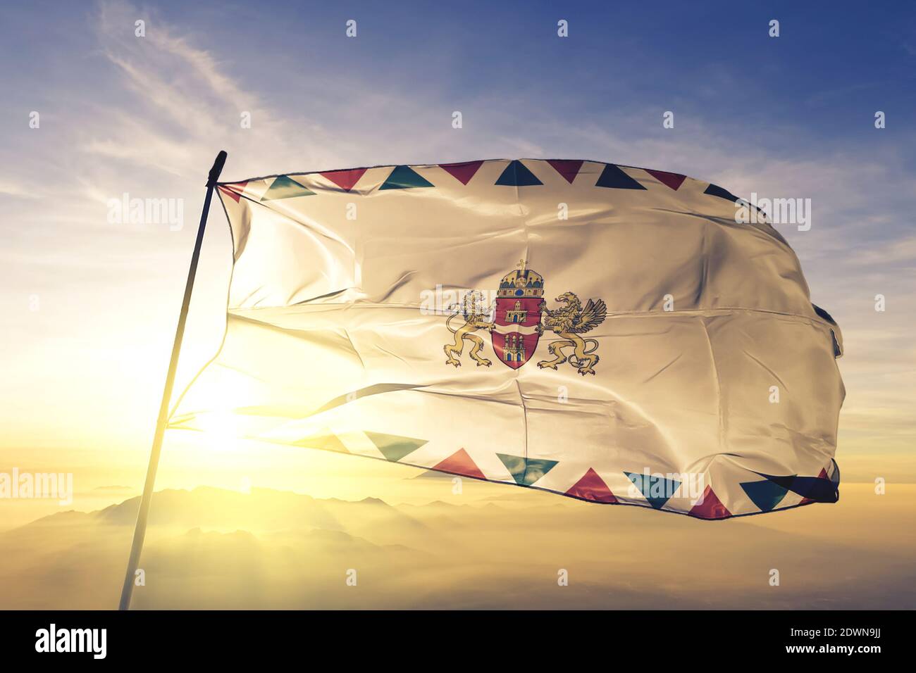 Budapest city of Hungary flag waving on the top sunrise mist fog Stock ...