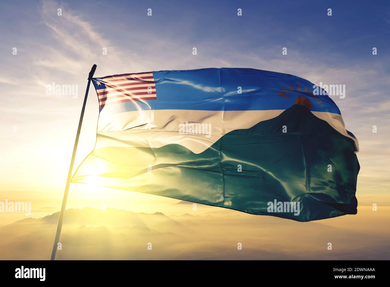 Grand Gedeh county of Liberia flag waving on the top sunrise mist fog ...