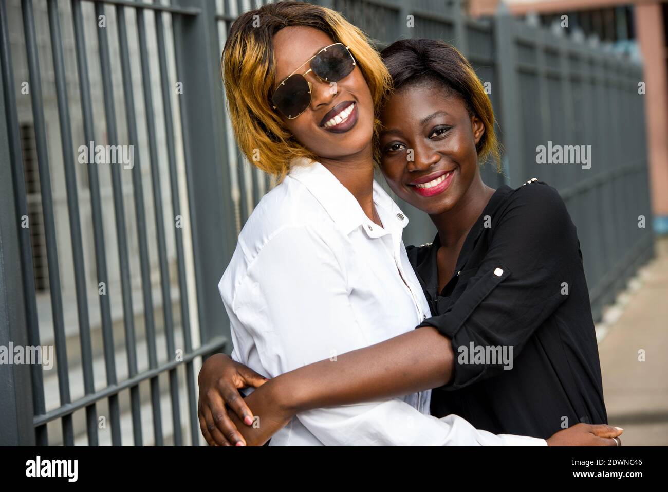 young girls standing together staring at the camera laughing Stock ...