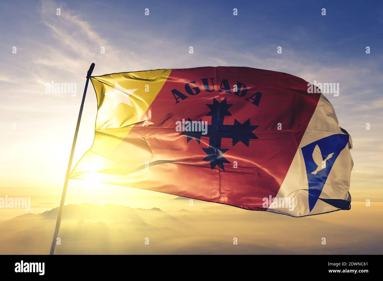 Aguada municipality of Puerto Rico flag waving on the top sunrise mist ...