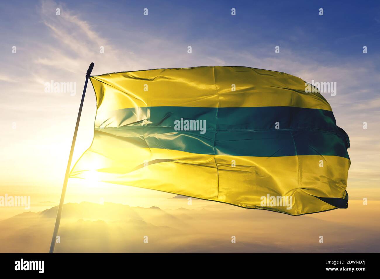 Isabela municipality of Puerto Rico flag waving on the top sunrise mist ...