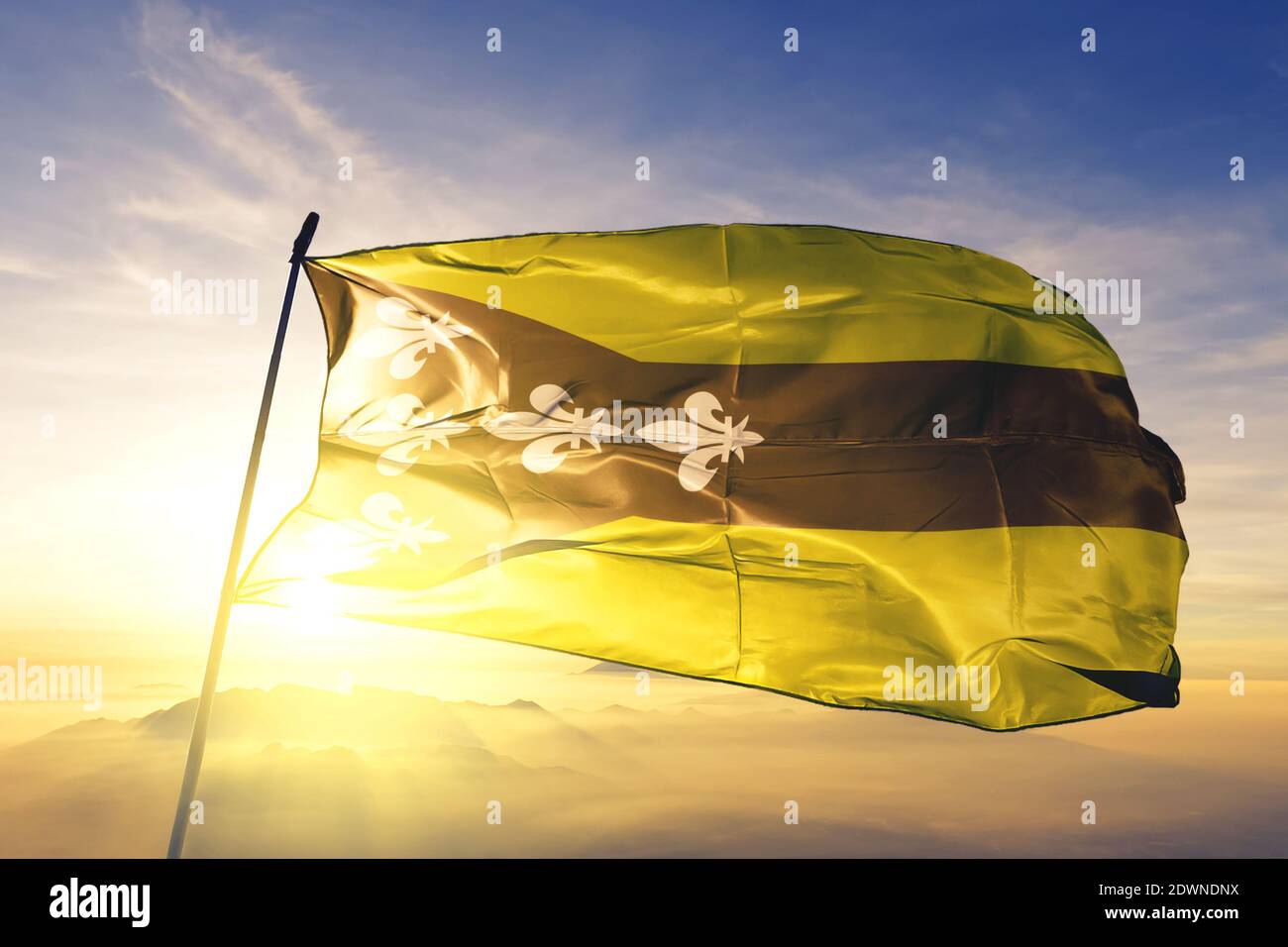 Dorado municipality of Puerto Rico flag waving on the top sunrise mist ...