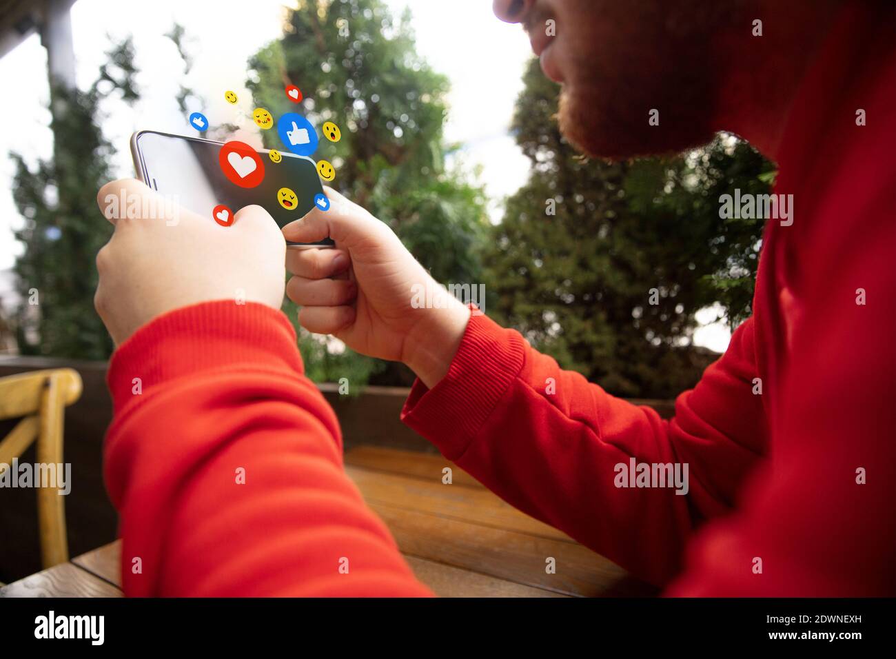 Man hands using new model of smartphone with icons social media ...
