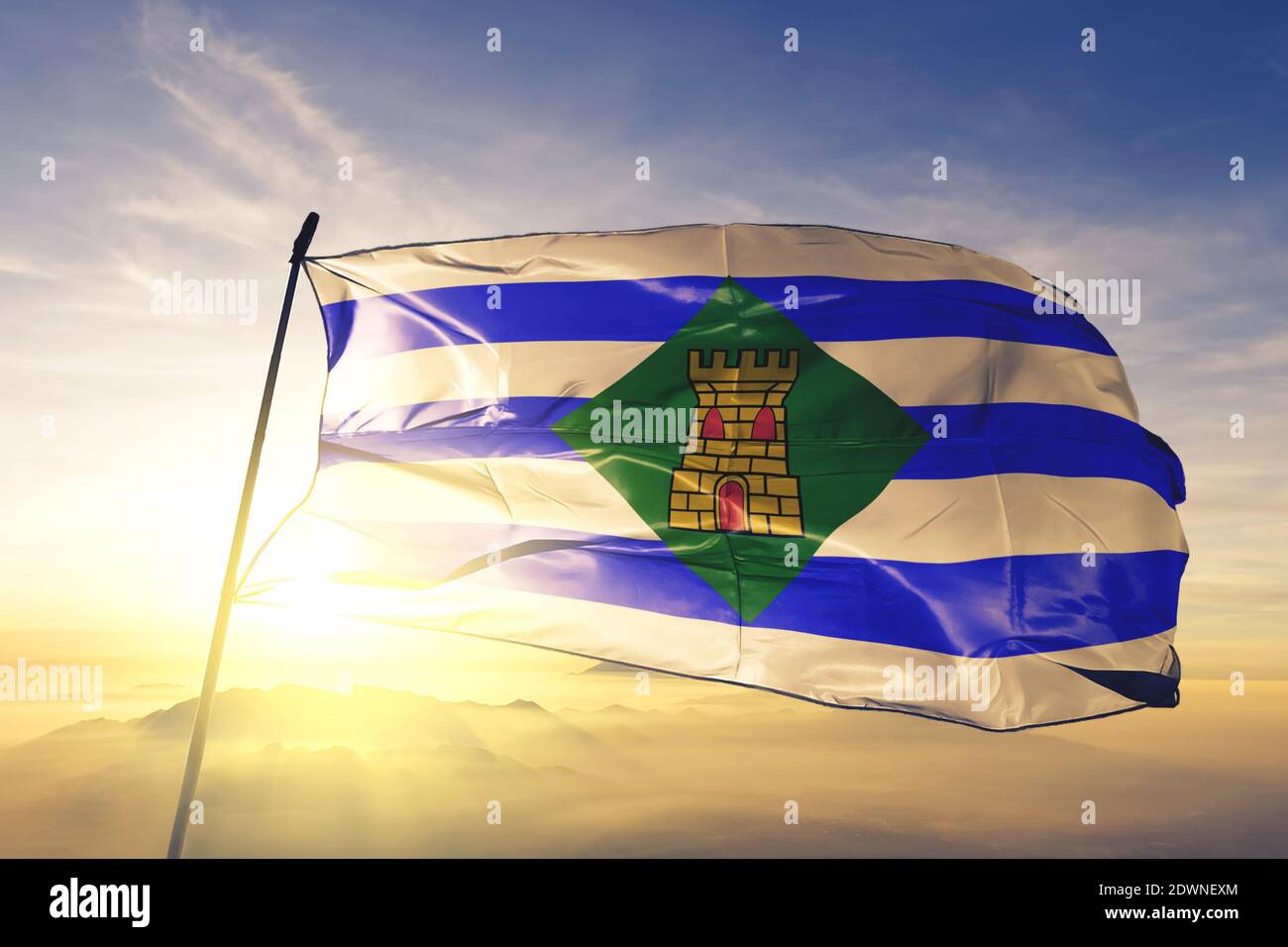 Vieques municipality of Puerto Rico flag waving on the top sunrise mist ...