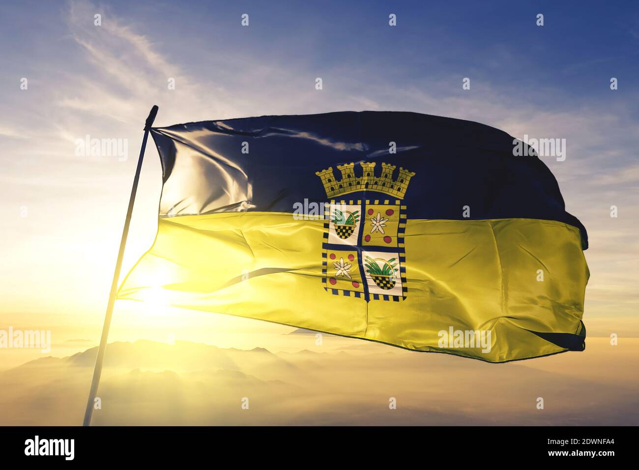 Yauco municipality of Puerto Rico flag waving on the top sunrise mist ...