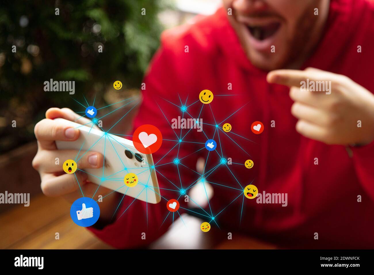 Young man using new model of smartphone with icons social media Stock ...