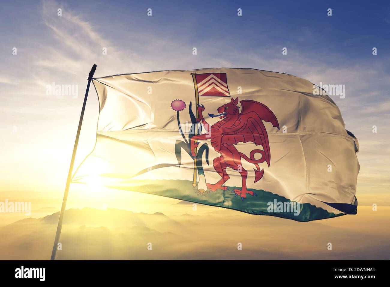 Cardiff of Wales flag waving on the top sunrise mist fog Stock Photo ...