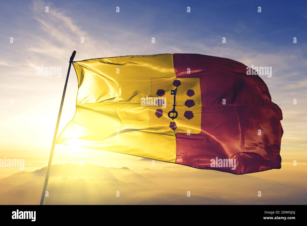 Comines-Warneton of Hainaut of Belgium flag waving on the top sunrise ...